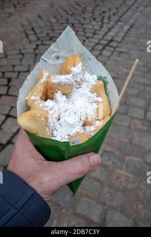 Fresh pastry held in hand at a cafe during the afternoon Stock Photo ...