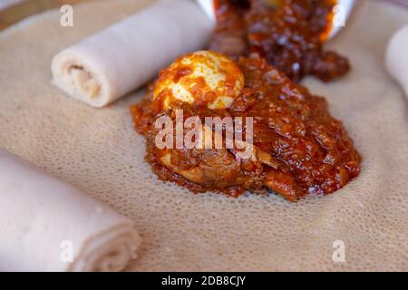 African food. Chicken, egg Doro Wat, berbere, lentils and Injera, the ...