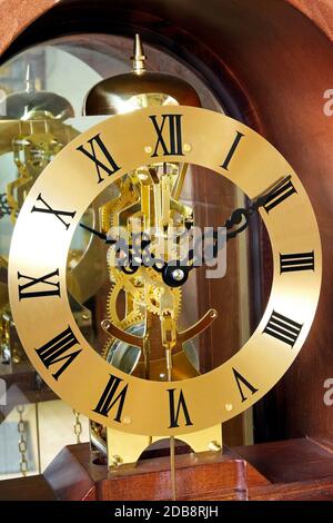 Close up shot of analogue gold clock Stock Photo - Alamy