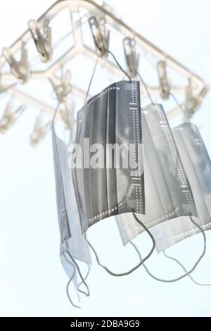Hanging surgical masks out to dry on a sunny day Stock Photo - Alamy