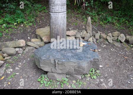 Slavic pagan idol with a stone altar standing near contemporary pagan ...