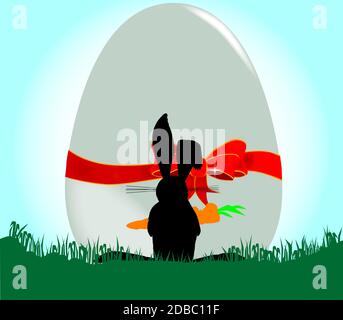An amazed rabbit confronted by a giant Easter egg Stock Photo - Alamy