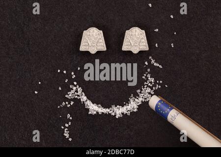 MDMA crystal and ecstasy pills forming smiley face Stock Photo - Alamy