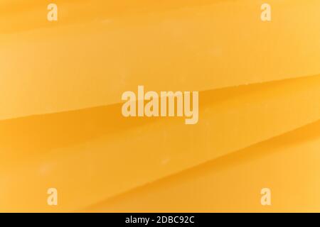 Solid cheese slices macro closeup. Background Texture Stock Photo - Alamy