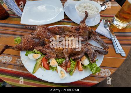Dish with roasted guinea pig as is served in Peru restaurants Stock ...