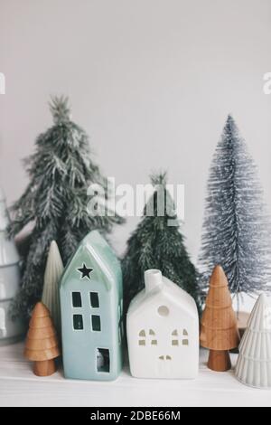 Beautiful ceramic Christmas trees on color background Stock Photo - Alamy
