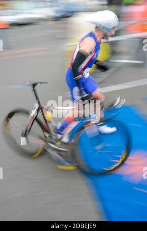 Competitors entering the transition area after the bike ride in the ...