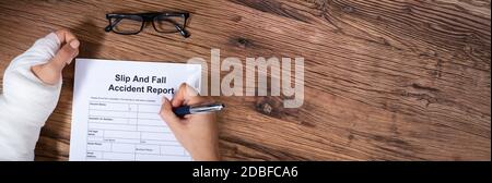 Woman Filling Slip And Fall Accident Report Stock Photo - Alamy