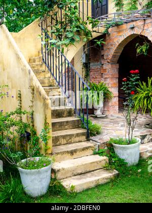 House frontyard cultured veneer stone work siding and rod iron stairs ...