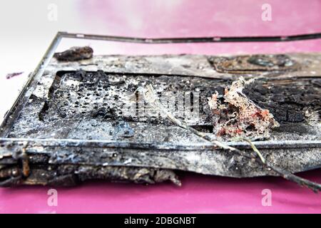 Computer Fire. Broken laptop computer spoiled by flame of hot fire ...