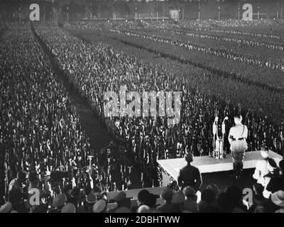 ADOLF HITLER STANDING ON ROSTRUM Nazi Swastika emblem on front ...