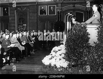 Joseph Goebbels (on the right of the lectern), a member of the NSDAP ...