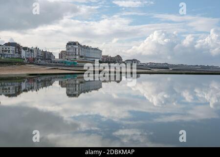 Nayland Rock Hotel and its reflection on a sea water pool on the beach ...