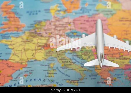 Toy of a plane flying over the Europe map Stock Photo - Alamy