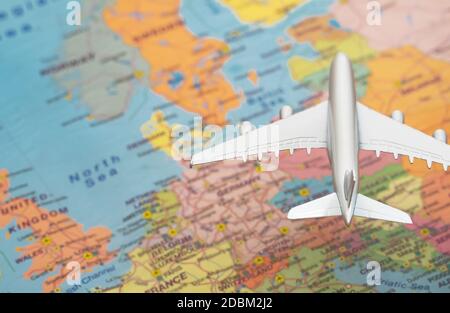 Toy of a plane flying over the Europe map Stock Photo - Alamy