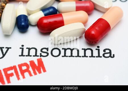 Pills on insomnia text Stock Photo - Alamy