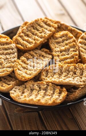 Rusk bread. Dried crispbread on plate. Top view Stock Photo - Alamy