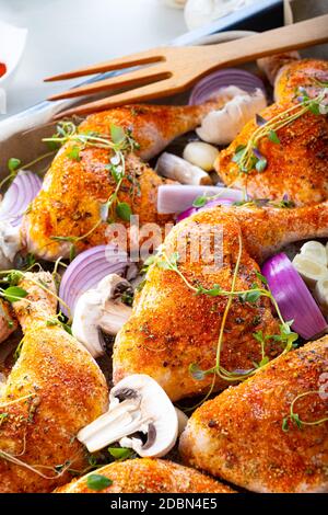 Prepared chicken legs with various vegetables and herbs Stock Photo - Alamy