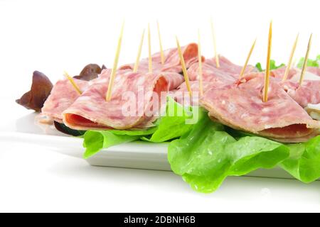 various ham pieces on plate closeup Stock Photo - Alamy