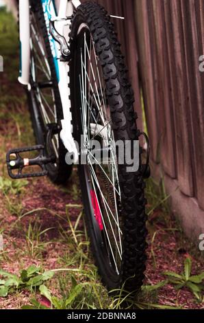 bicycle wheel outdoor near fence Stock Photo - Alamy