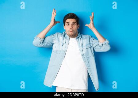 Distressed guy showing mind blowing gesture, looking frustrated and ...