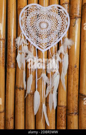 Beautiful dream catcher on beige background Stock Photo - Alamy