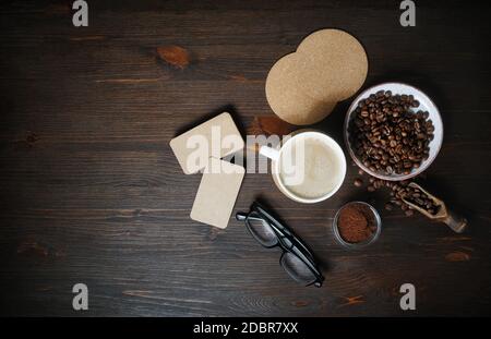 Delicious fresh coffee. Blank kraft paper business cards, coffee cup ...
