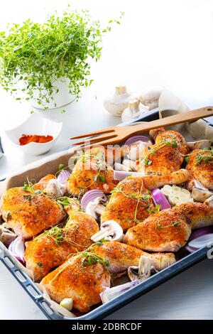 Prepared chicken legs with various vegetables and herbs Stock Photo - Alamy