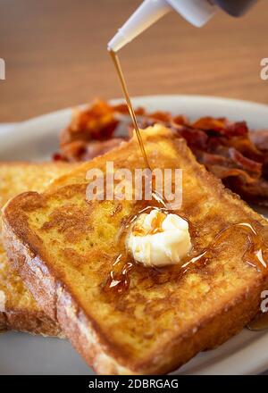 Two pieces of golden brown toast on white background Stock Photo - Alamy