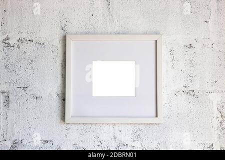 Simply picture frame on white wall, stock photo Stock Photo - Alamy