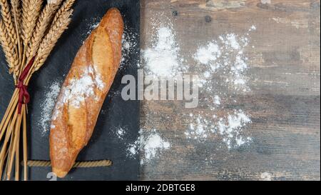 a baguette or French bread and some wheat ears, old notebook Stock ...
