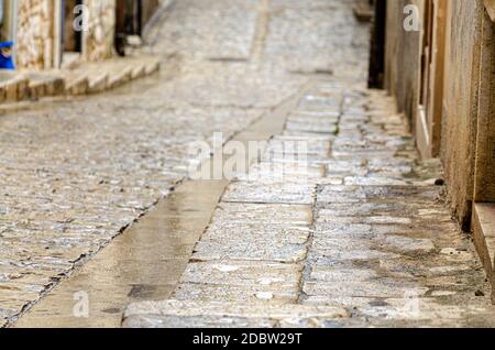 Detail of an ancient Sicilian stone road Stock Photo - Alamy