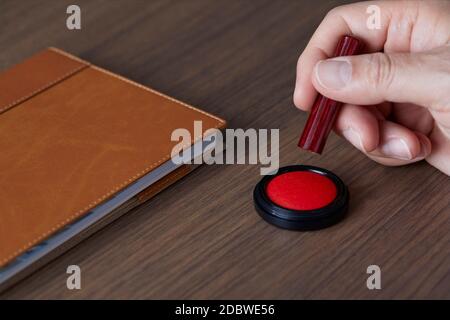 Man Putting Seal Stock Photo - Alamy