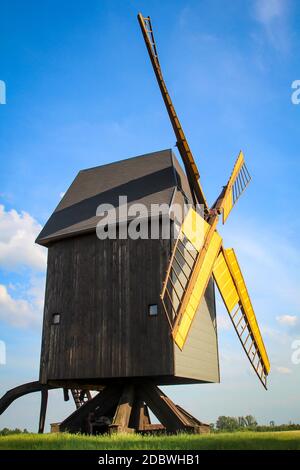View of a well-preserved old post mill Stock Photo - Alamy