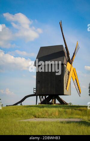 View of a well-preserved old post mill Stock Photo - Alamy
