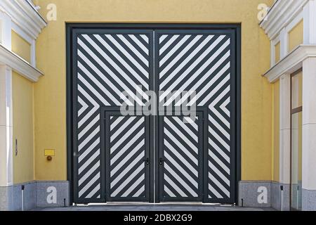 Big double doors with diagonal stripe lines Stock Photo - Alamy