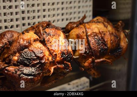Fresh Cooked Rotisserie Chicken Still Rotating Inside the Rotisserie ...