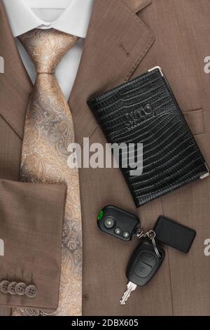 Driver's license and car keys lying on the jacket, can be used as ...