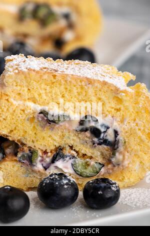 Blueberry roulade with icing sugar Stock Photo - Alamy