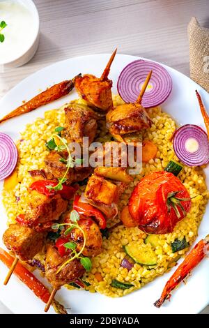 Shish kebabs with vegetables and bulgur Stock Photo - Alamy