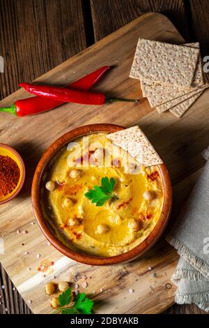 Delicious hummus paste with lemon and chilli Stock Photo - Alamy