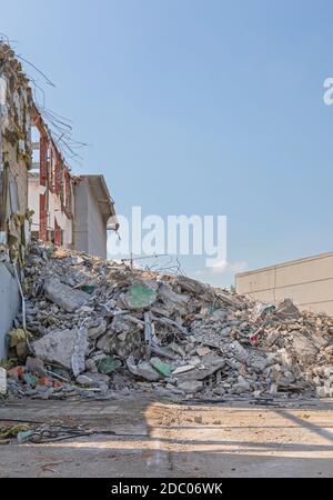 Demolition rubble of a collapsed building. Heap of steel reinforced ...
