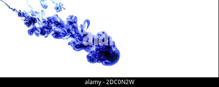 Blue ink injected into water from syringe, colour mixing with water ...