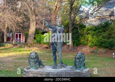 An Old Statue of an Archer With a Lion On Each Side Stock Photo - Alamy