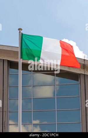 Italian National Flag Tricolor in Front of Building Stock Photo - Alamy