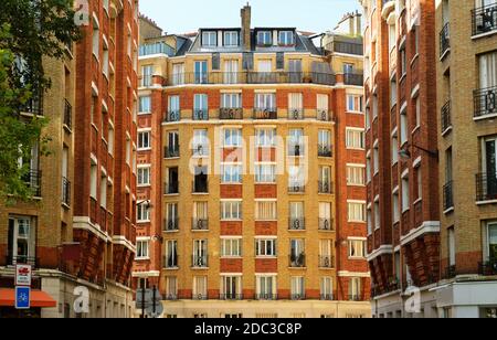 Facade of typical building, made with bi-color bricks, in Paris Stock ...