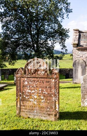 Gravestones in the grounds of the 19th century Church of St. Barrahane ...