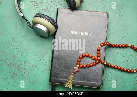 Hole Bible and rosary beads on color background Stock Photo - Alamy