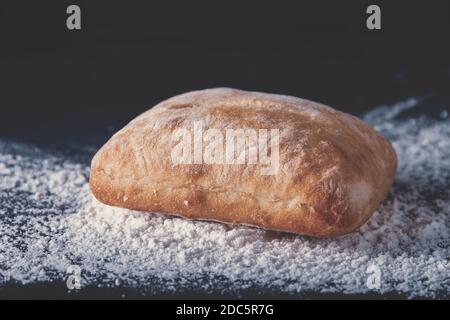 Freshly baked bread with spilled flour Stock Photo - Alamy