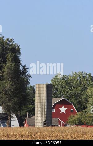 Kansas Red and White Barn with blue sky,white clouds, with tree's and ...